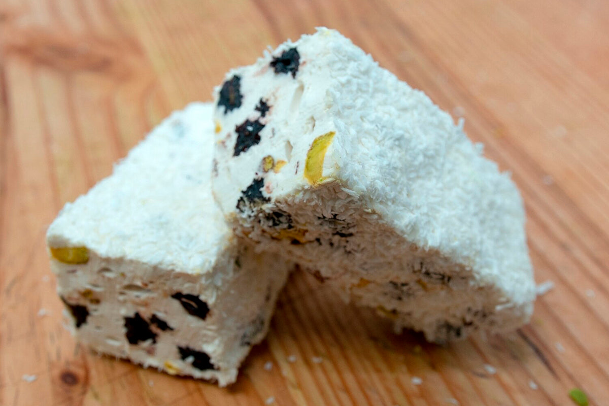 SUJUK PISTACHIO AND GRAPE W/MILK FLAVOR COATED WITH COCONUT – Palm Sweets